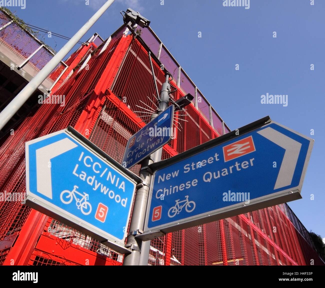 Birmingham information sign and cctv security camera near bright red ...