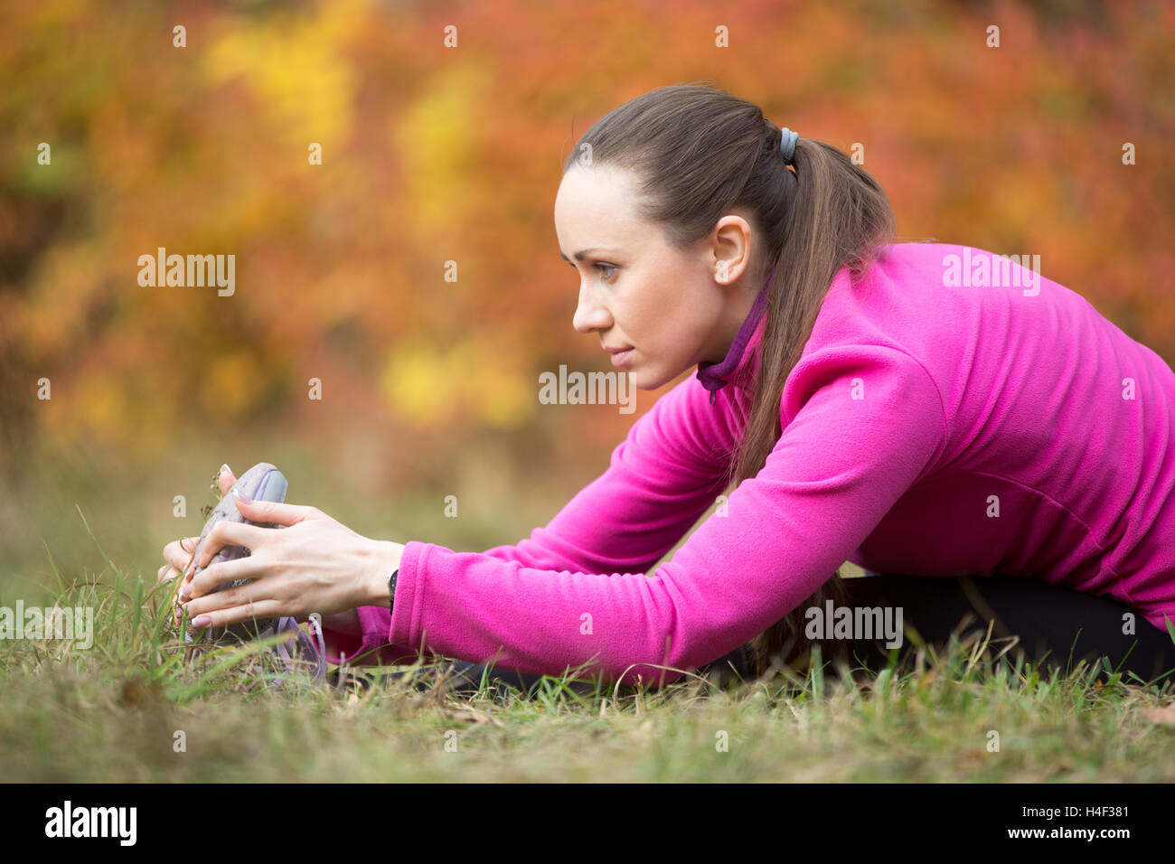 Autumn yoga: Seated Forward Bend yoga pose Stock Photo - Alamy