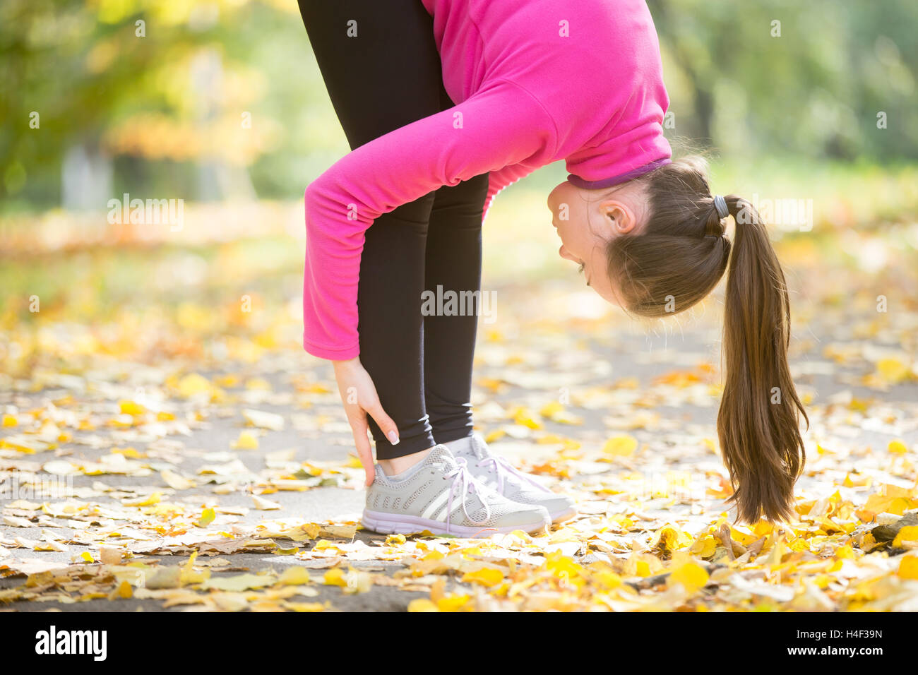 Fall Yoga outdoors: intense stretch pose Stock Photo - Alamy