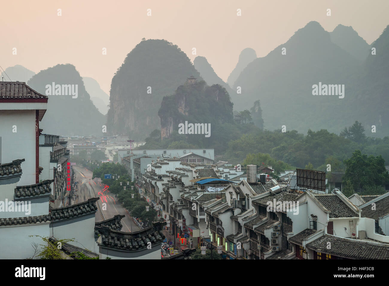 View of evening city and mountains in Yangshuo, China Stock Photo - Alamy