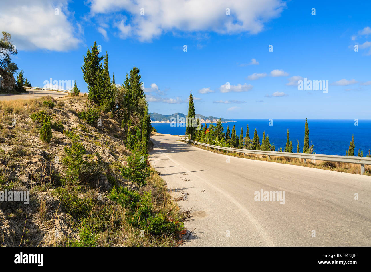Scenic coastal road to Assos village in mountain landscape of Kefalonia ...