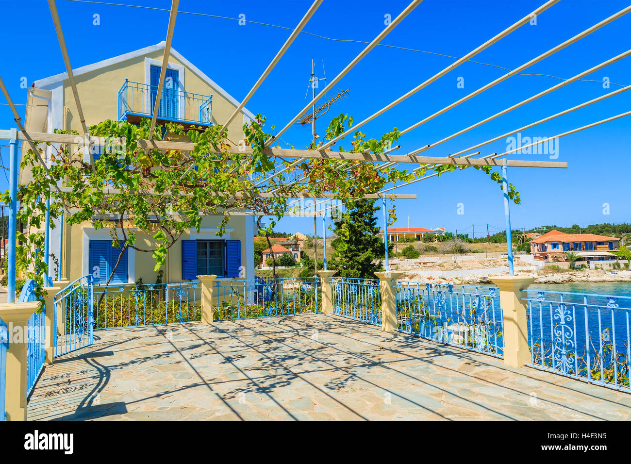 Traditional greek house with vine growing on terrace in Fiskardo ...