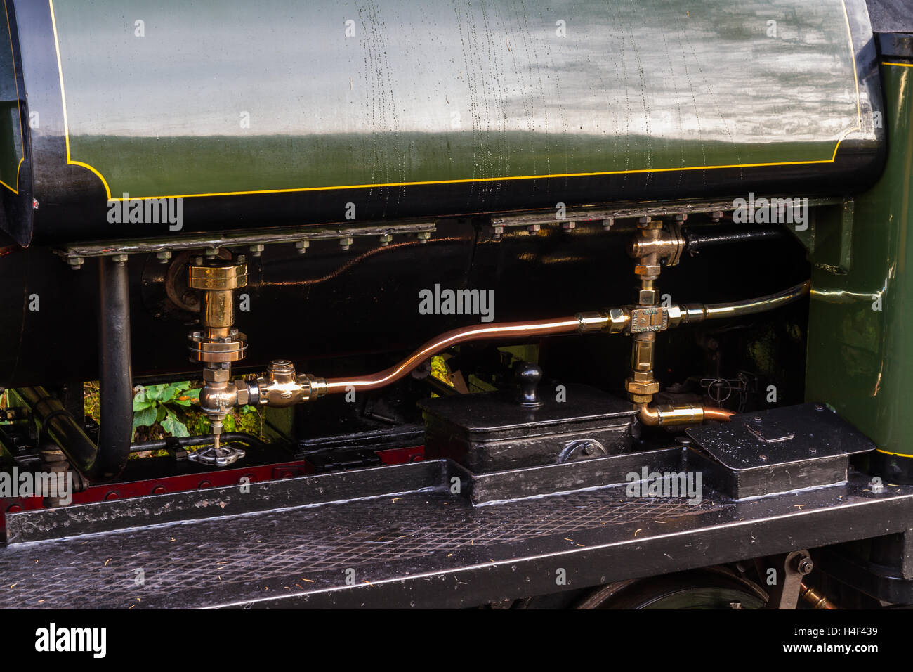 Close up of brass pipes on outside of steam locomotive Stock Photo - Alamy