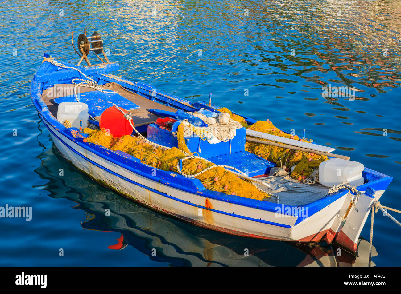 Traditional Greek fishing boat on sea water in Agia Efimia port ...