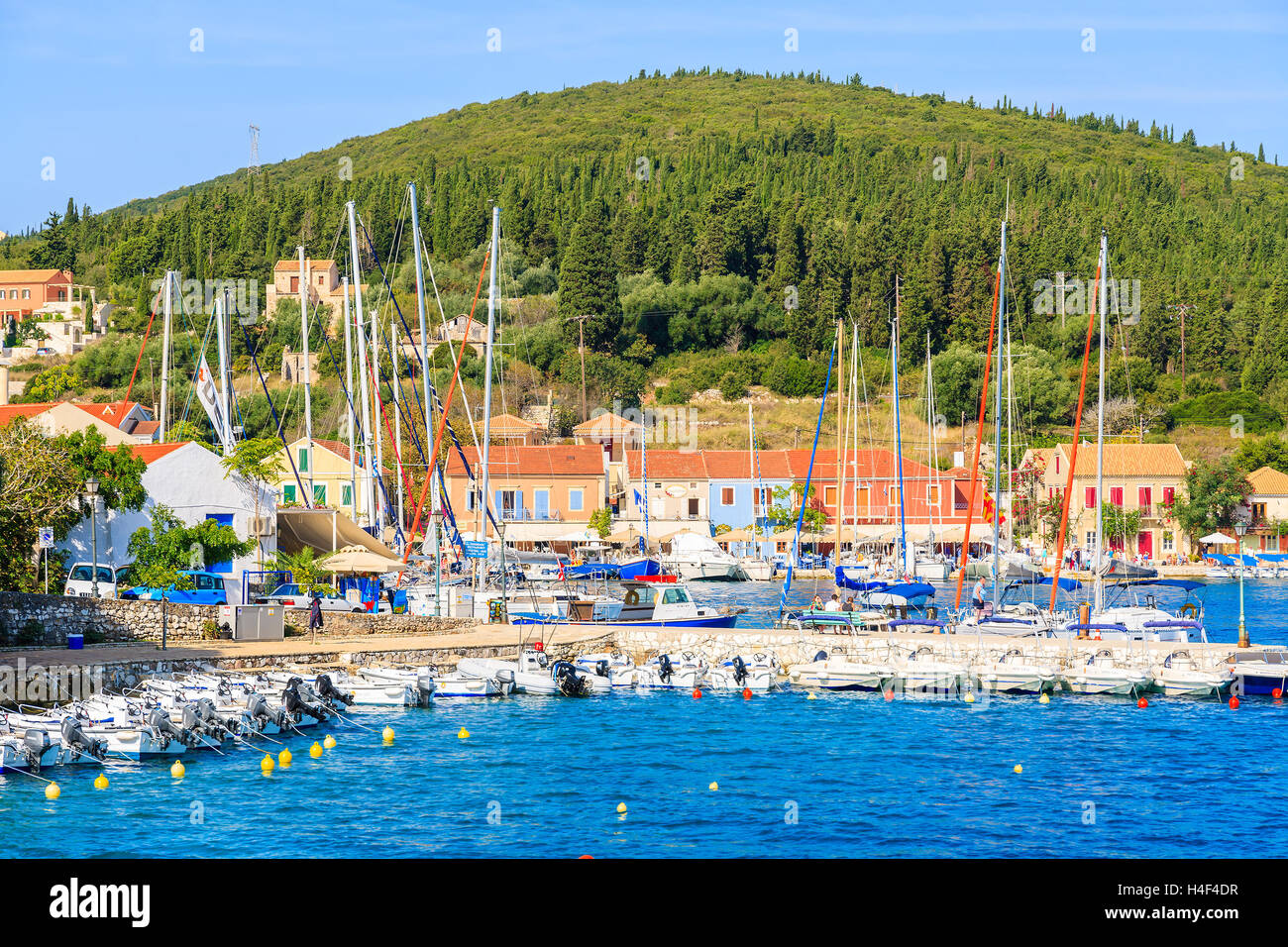 FISKARDO PORT, KEFALONIA ISLAND - SEP 19, 2014: view of colorful houses ...