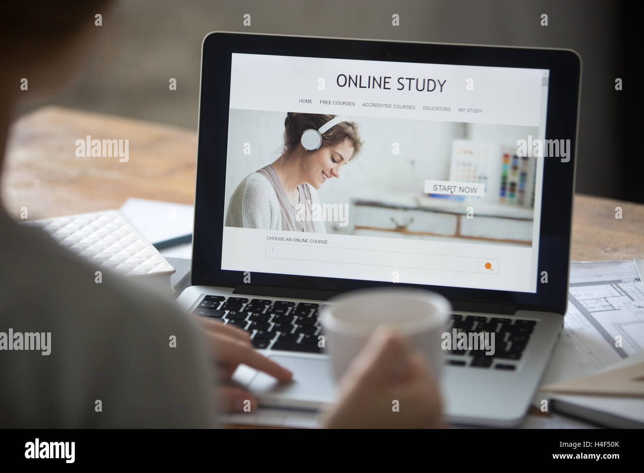 Open laptop on the desk, with online study on screen Stock Photo - Alamy