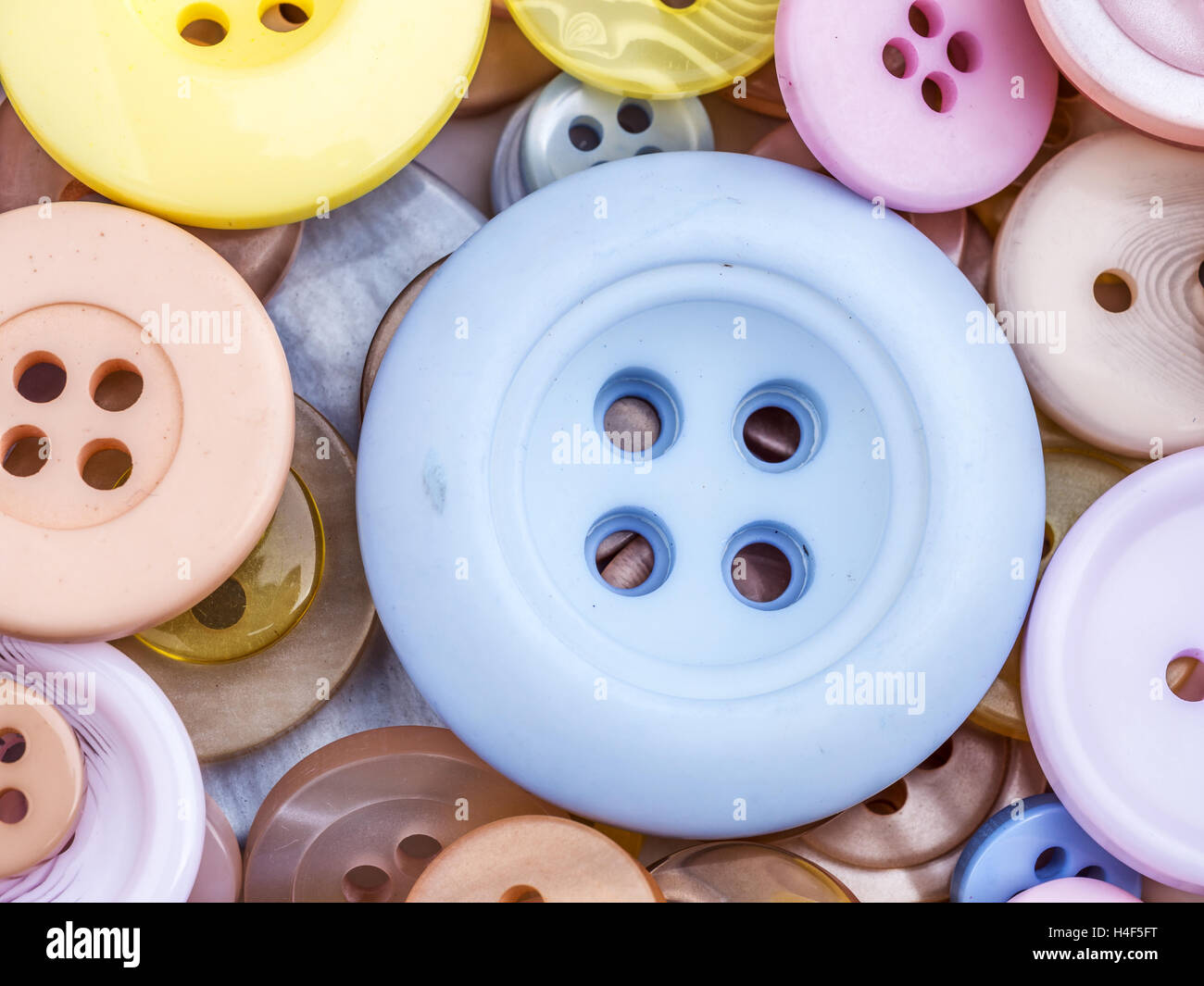 Pile of apparel buttons in different size and colors shot from above ...