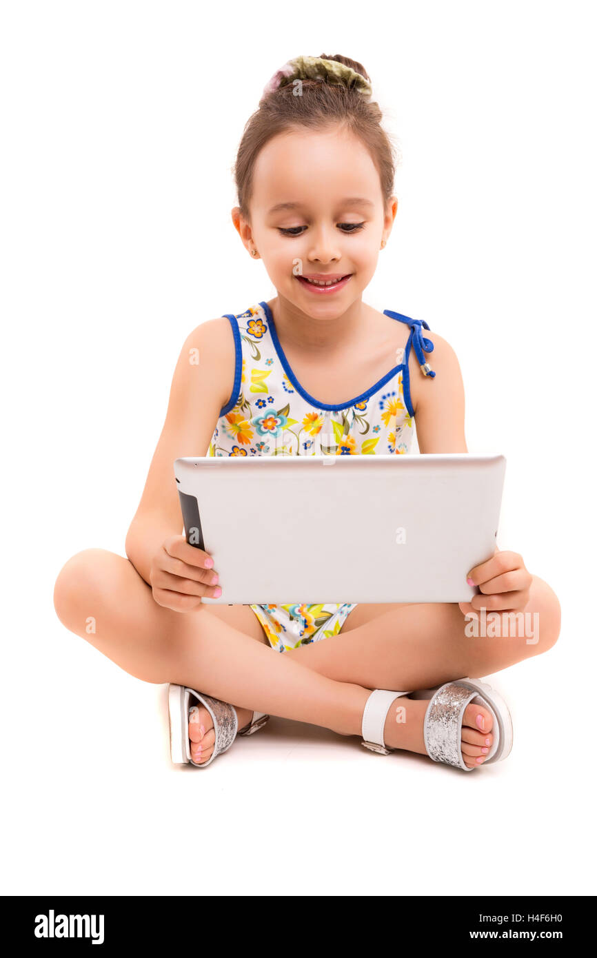 Small girl playing with her new tablet computer Stock Photo - Alamy