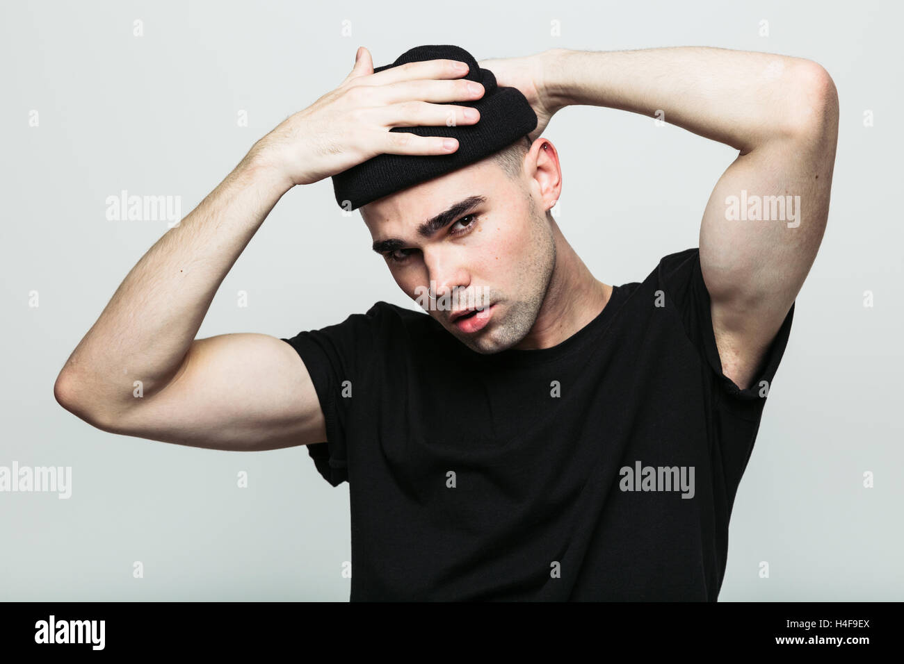 Putting on hat hi-res stock photography and images - Alamy