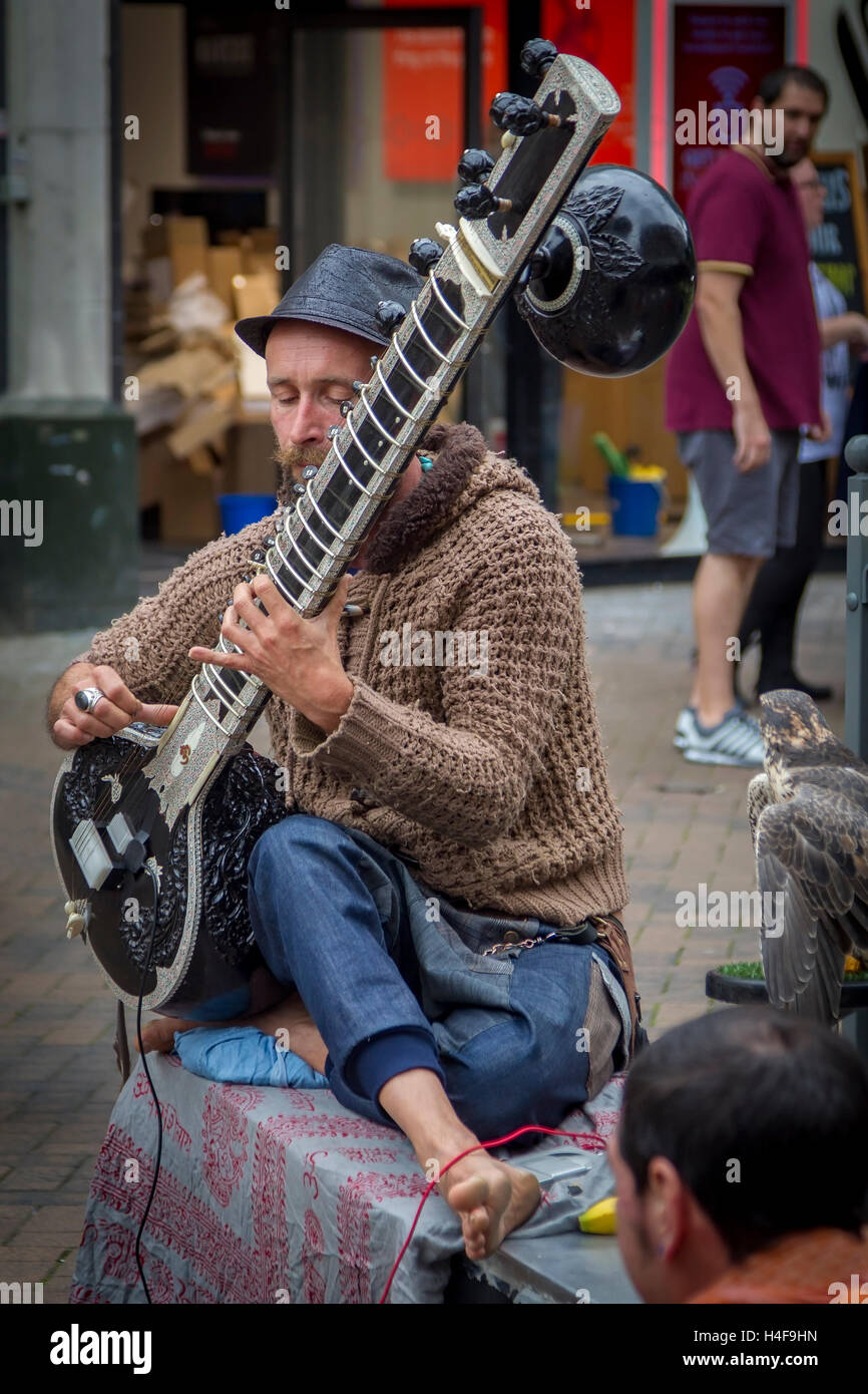 Buskers playing a Grand Pro Tun Sitar a Indian instrument in Abington ...