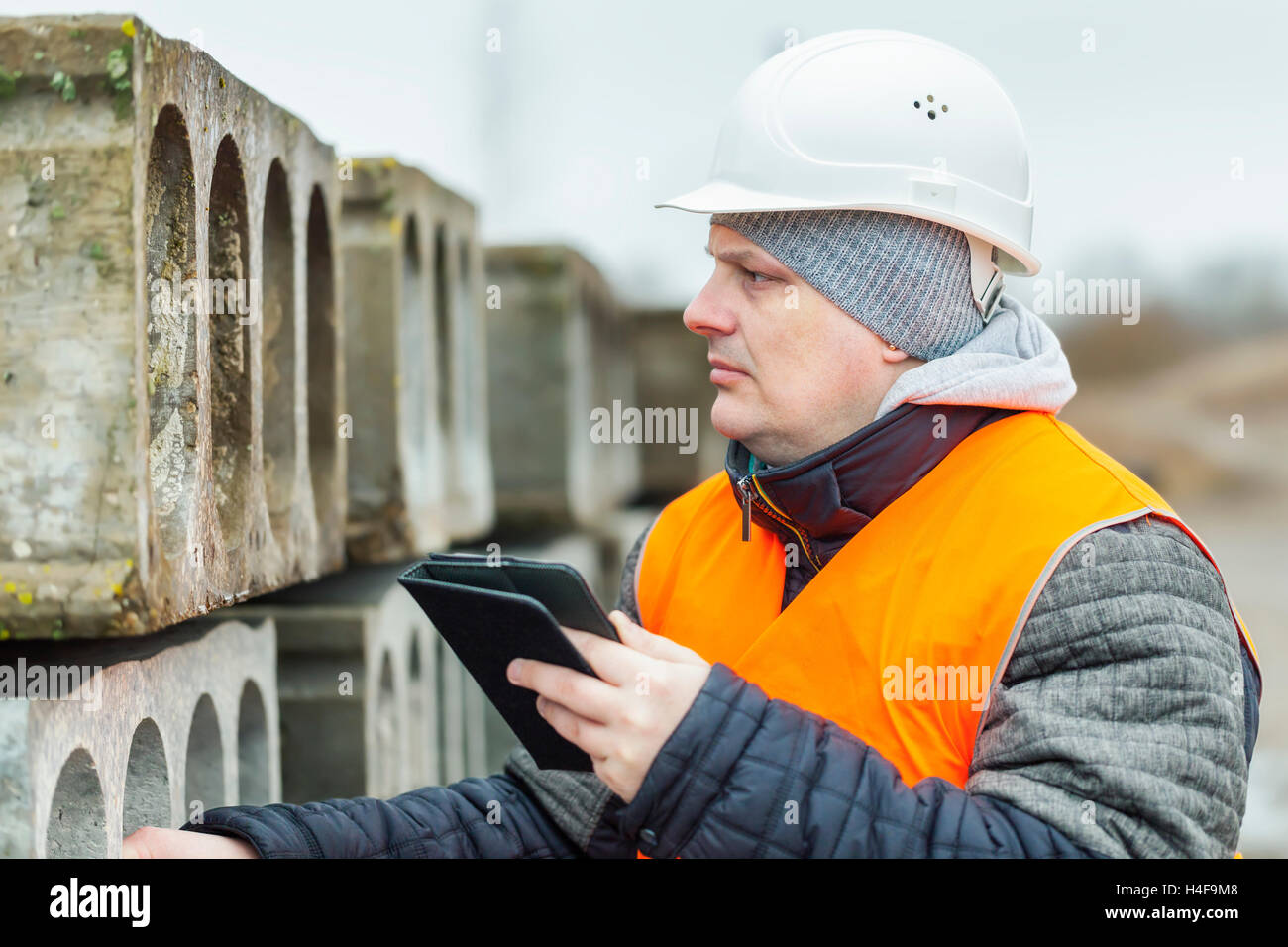 Civil engineer with tablet PC near the construction panels Stock Photo ...