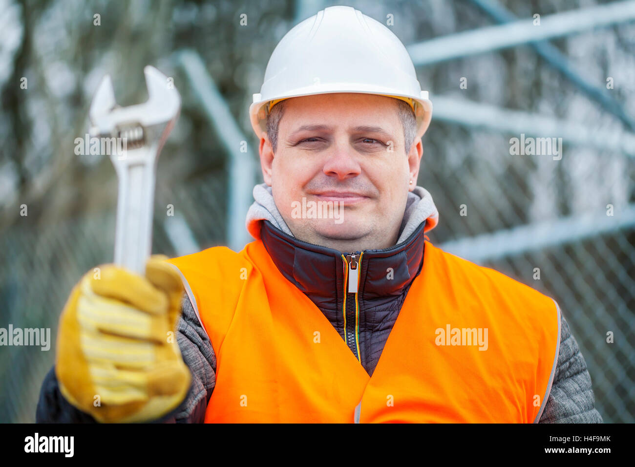 Worker with adjustable wrench at outdoors Stock Photo - Alamy