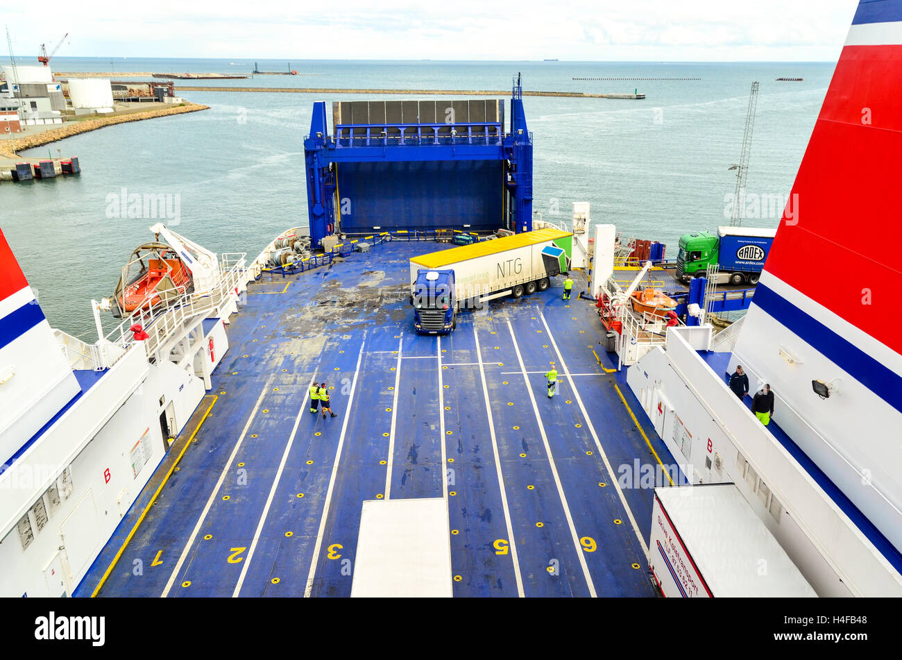 Trucks loading on a ferry in Frederikshavn, Denmark, bound to ...