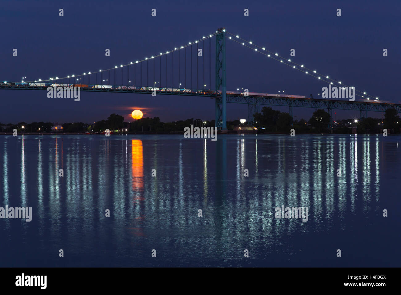 FULL MOON SETTING BELOW AMBASSADOR BRIDGE DETROIT RIVER DETROIT ...