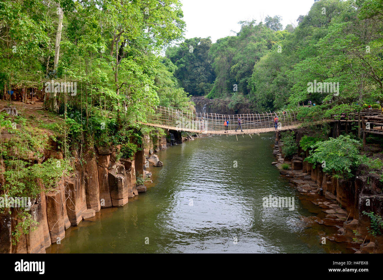 Wooden with bamboo bridge for cross over stream river from Tad Pha Suam ...