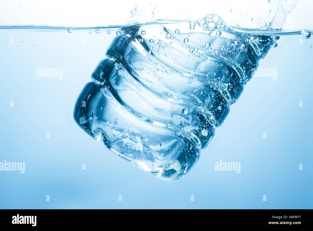 Bottle in under clean drinking water Stock Photo - Alamy