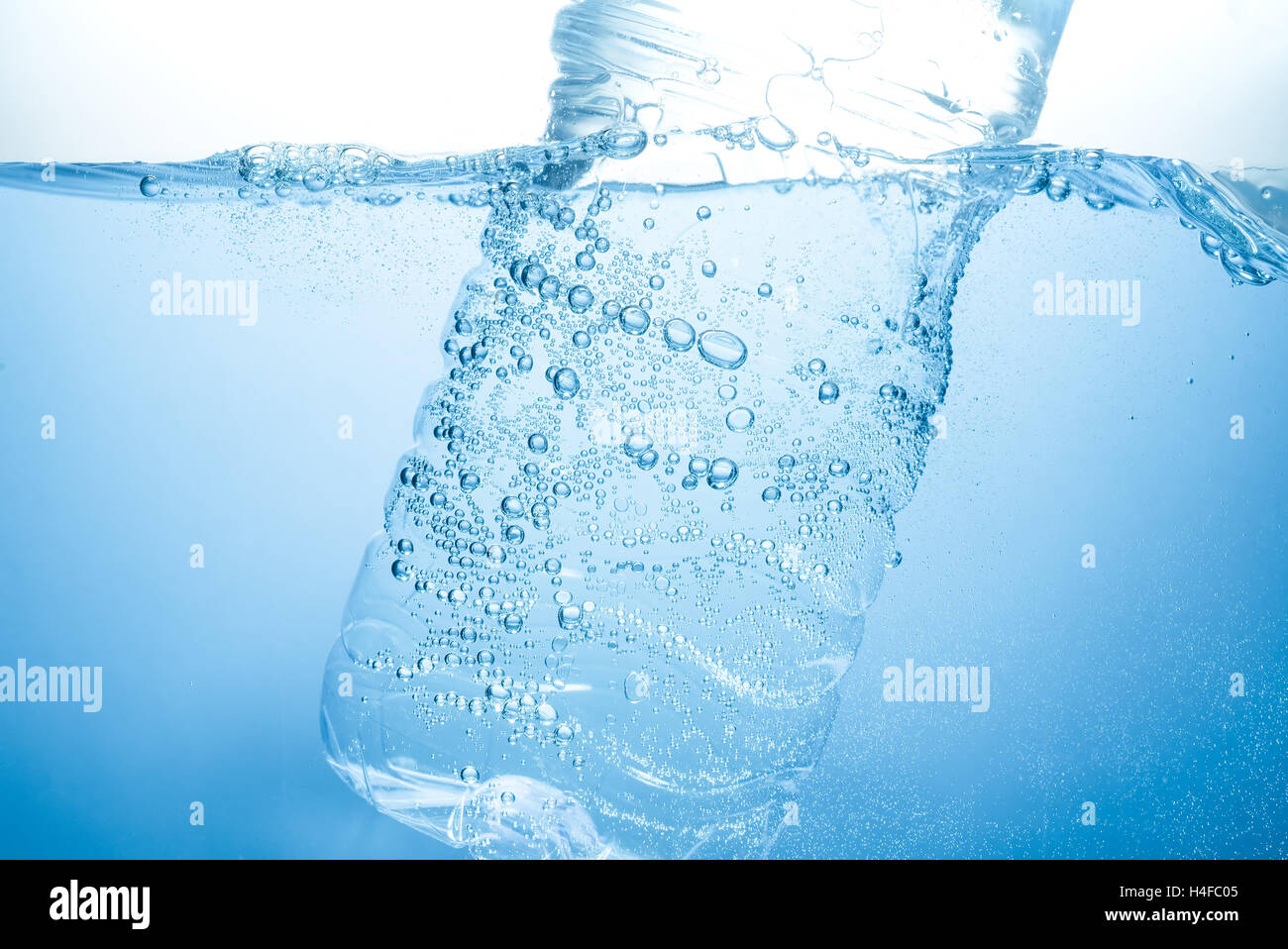 Bottle in under clean drinking water Stock Photo - Alamy