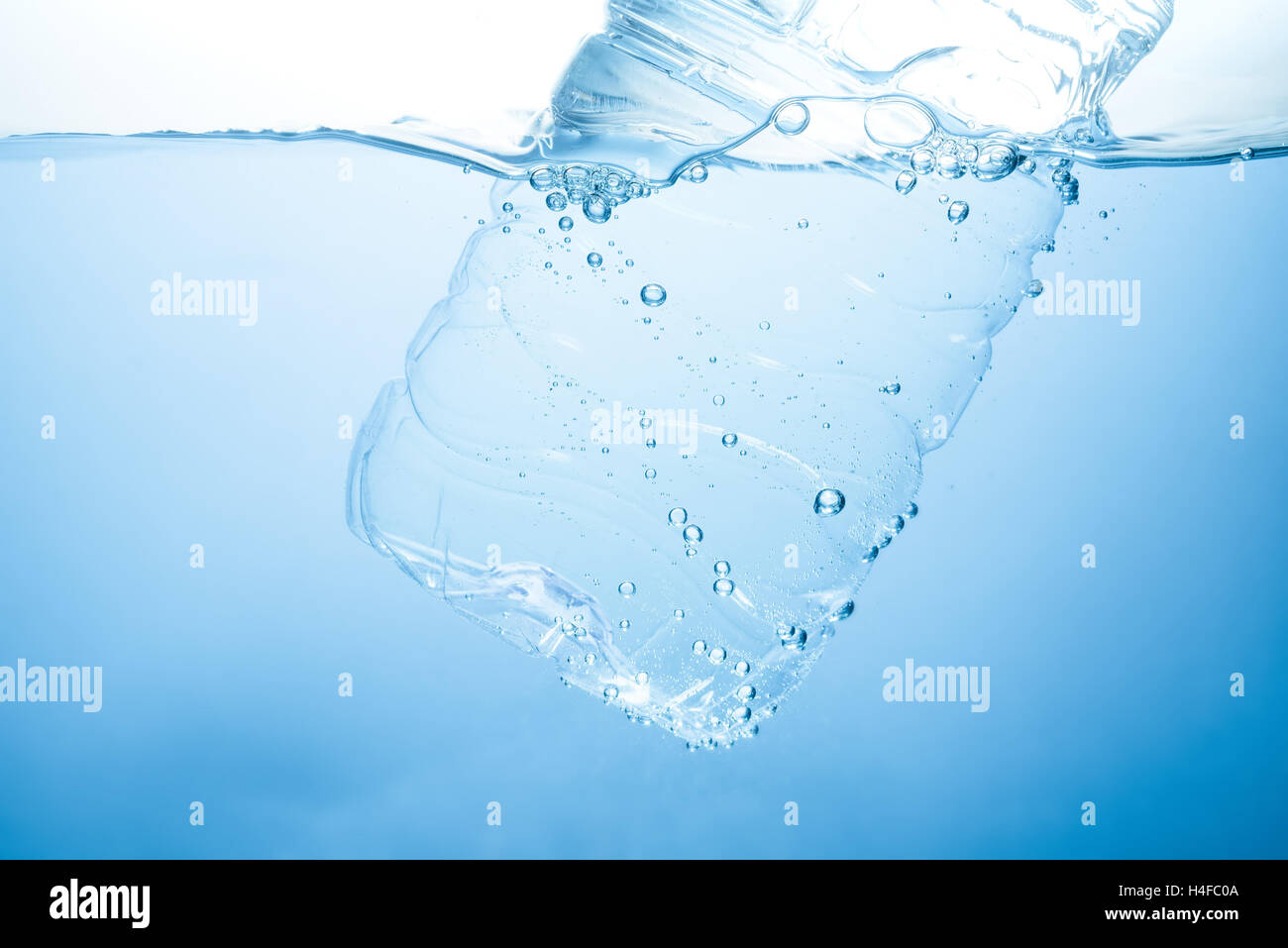 Bottle in under clean drinking water Stock Photo - Alamy