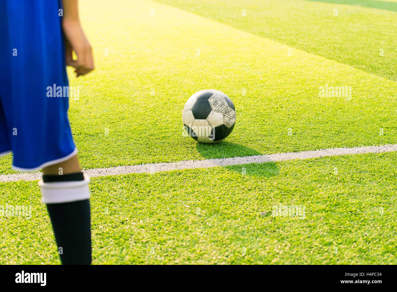 Soccer player ready to play at kick off the game in soccer field ...
