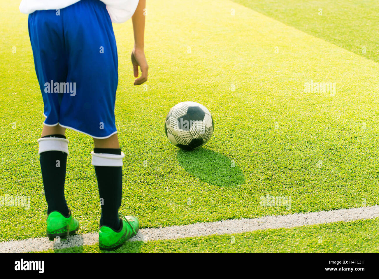 Soccer player ready to play at kick off the game in soccer field ...