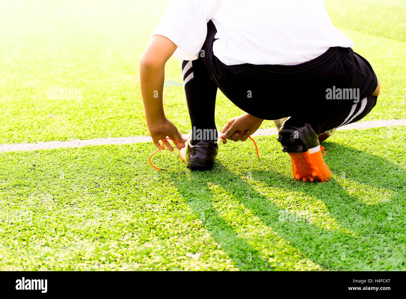 Soccer player ready to play at kick off the game in soccer field ...