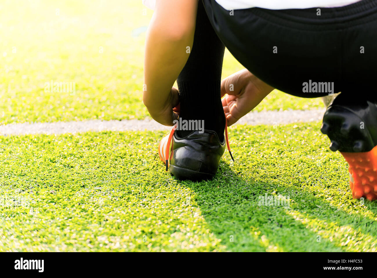 Soccer player ready to play at kick off the game in soccer field ...