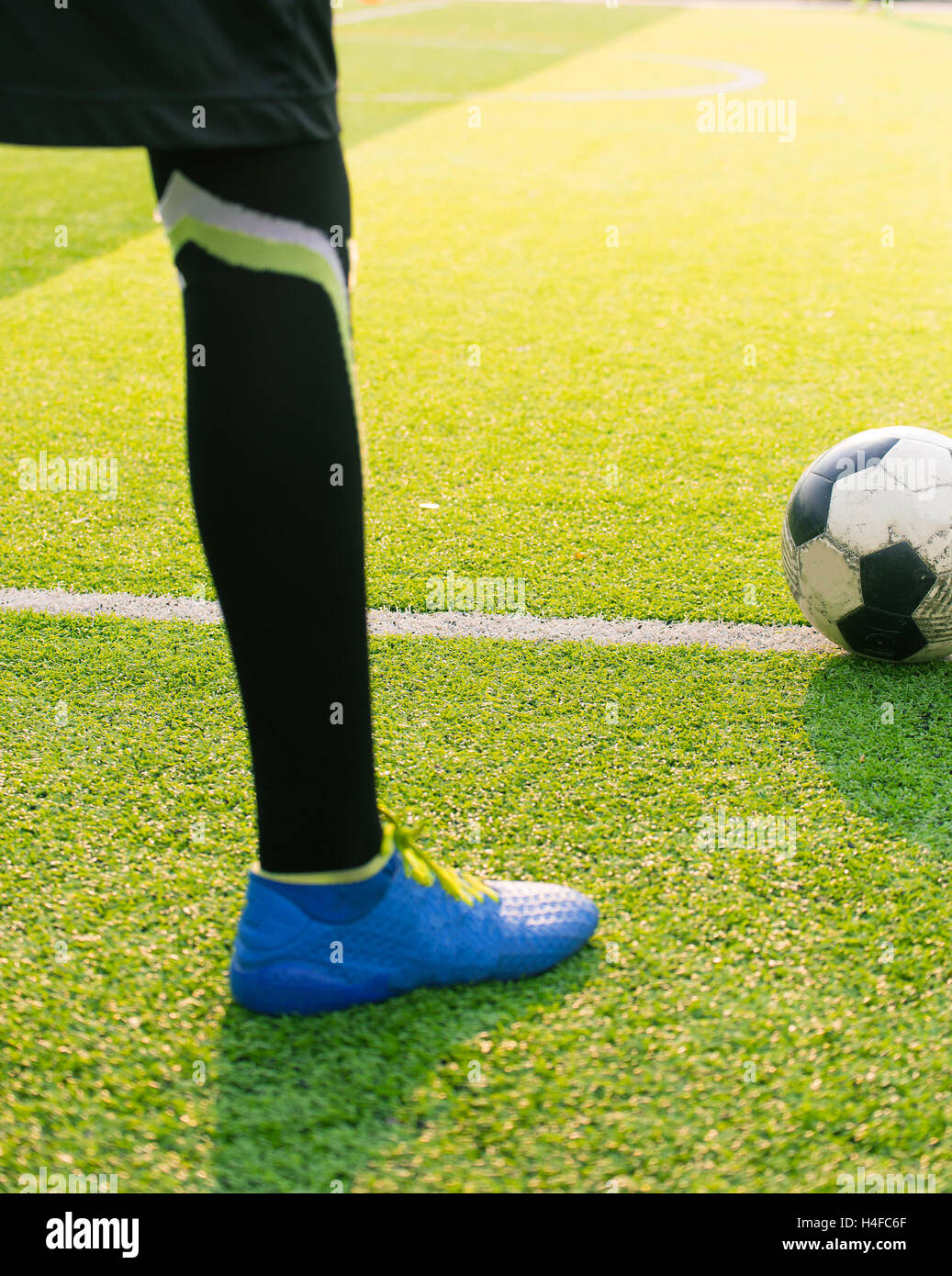 Soccer player ready to play at kick off the game in soccer field Stock ...
