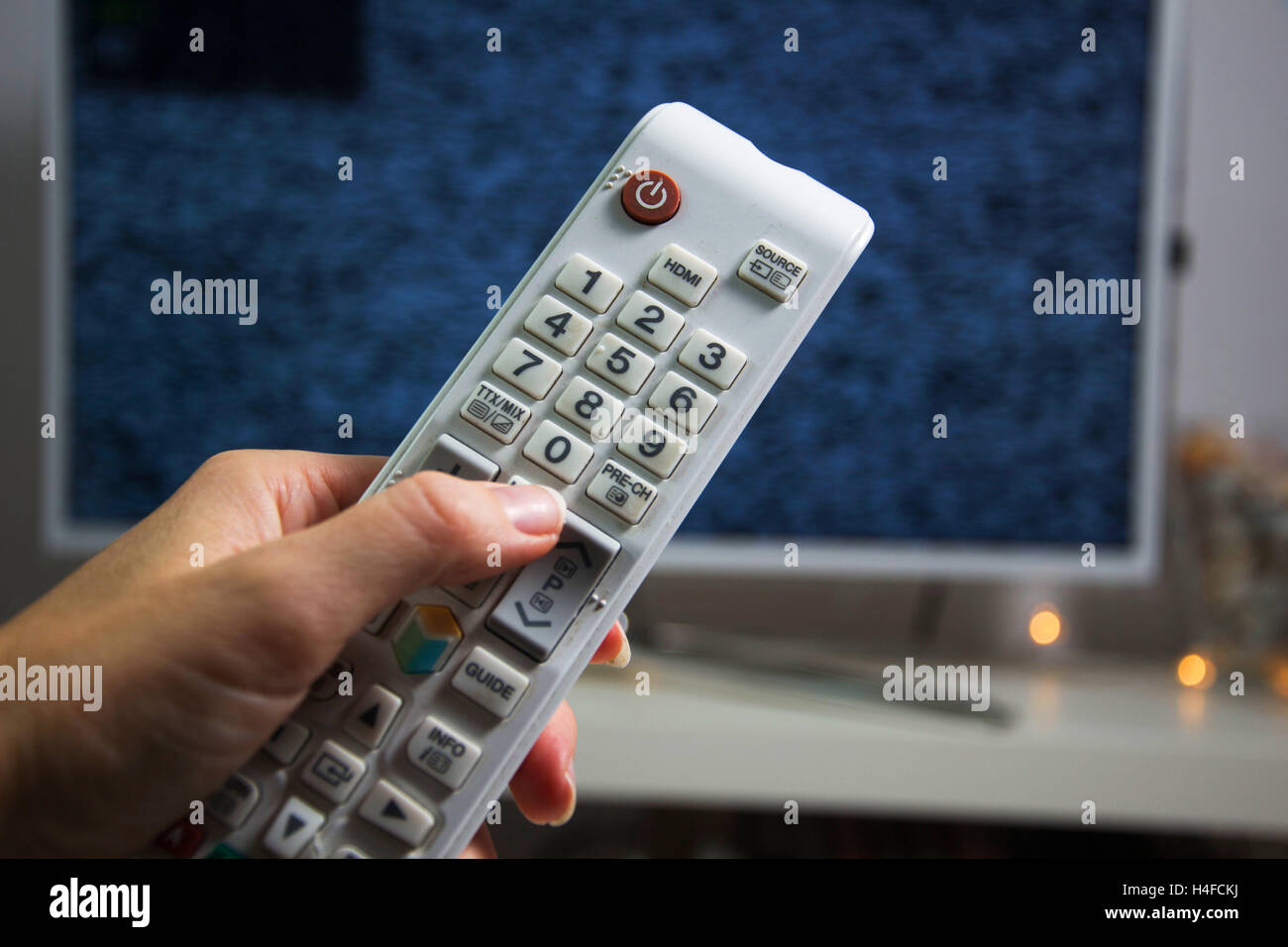 hand with white remote Stock Photo - Alamy