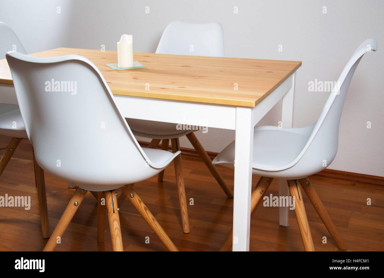 dining table with white chairs Stock Photo - Alamy