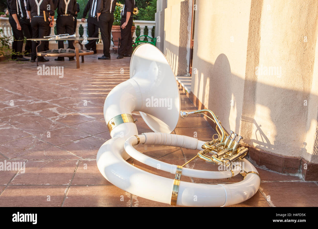 White sousaphone resting before performance while musicians talk Stock ...
