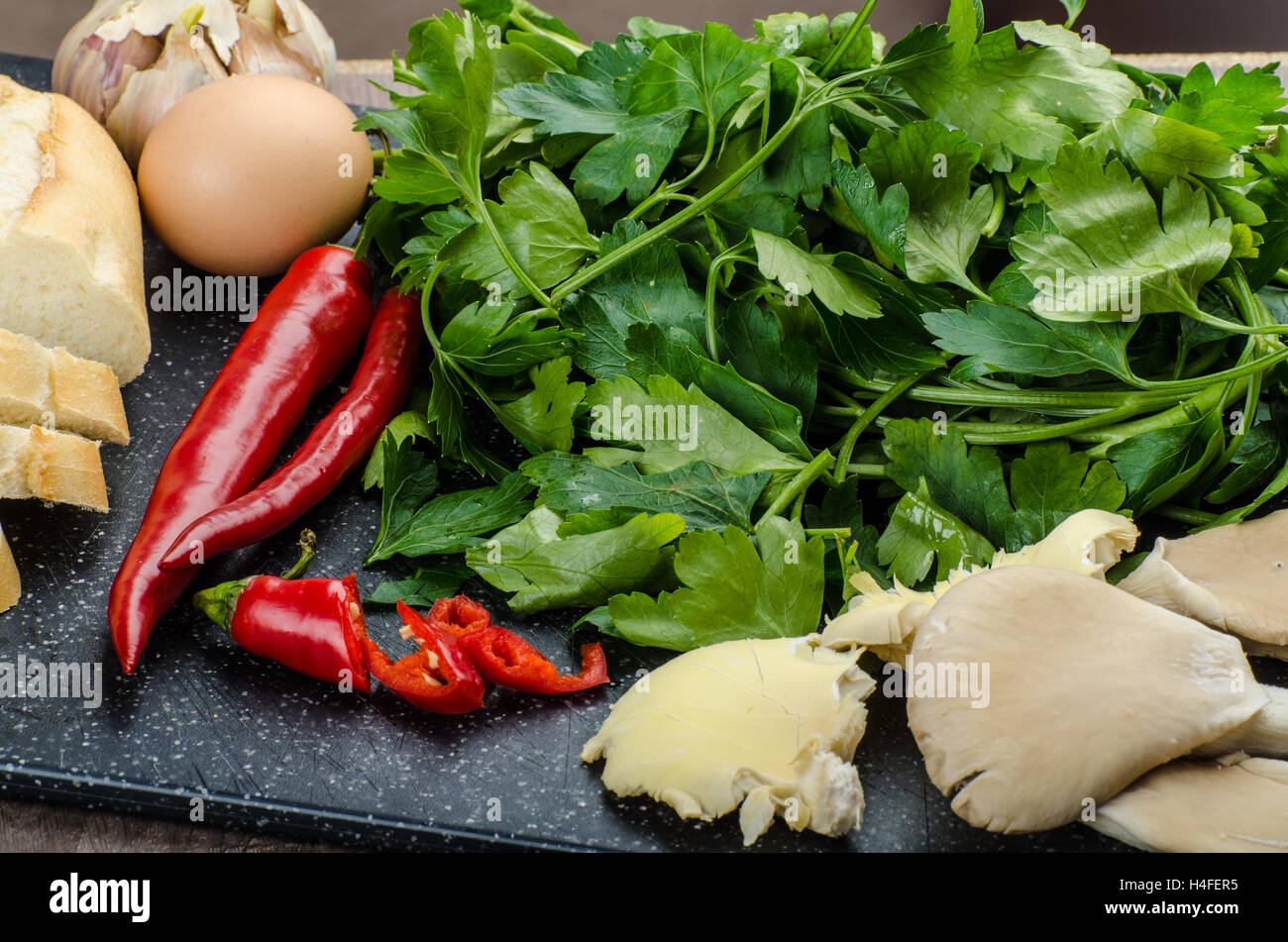 Rustic vegetarian omelette with chili peppers and mushrooms Stock Photo ...