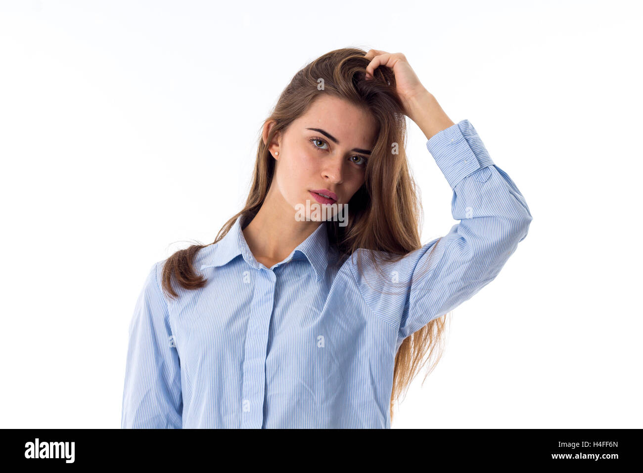 Woman fixing her hair Stock Photo - Alamy