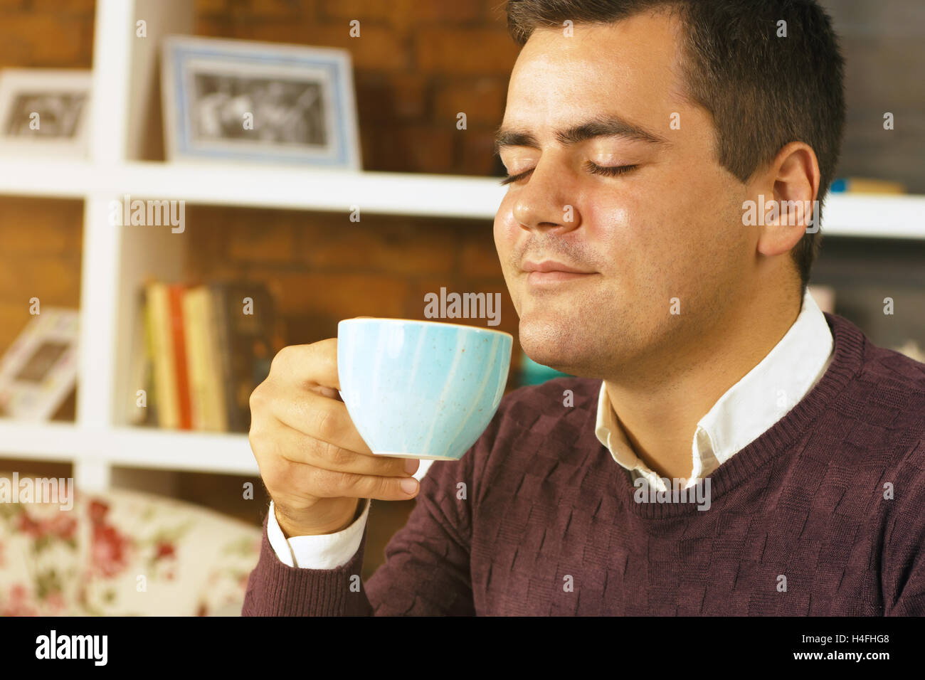 Young man mug tea thinking hi-res stock photography and images - Alamy