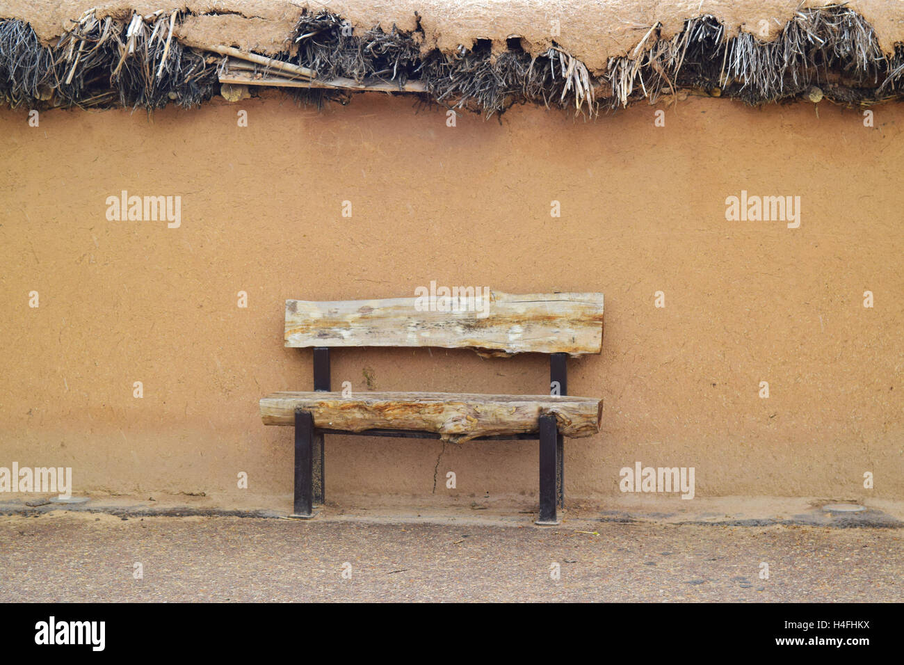 Wooden chair against wall hi-res stock photography and images - Alamy
