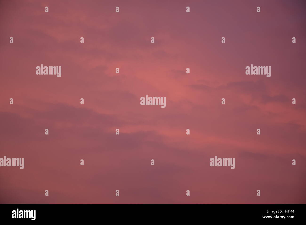 Red sunset sky texture with clouds Stock Photo - Alamy