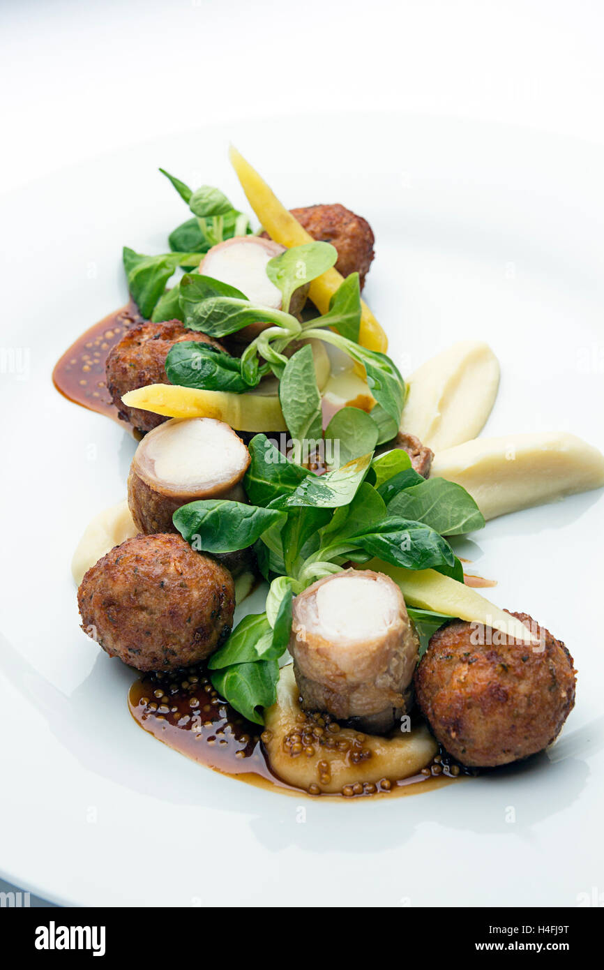 Rabbit and meatballs with mustard sauce and parsnip Stock Photo - Alamy