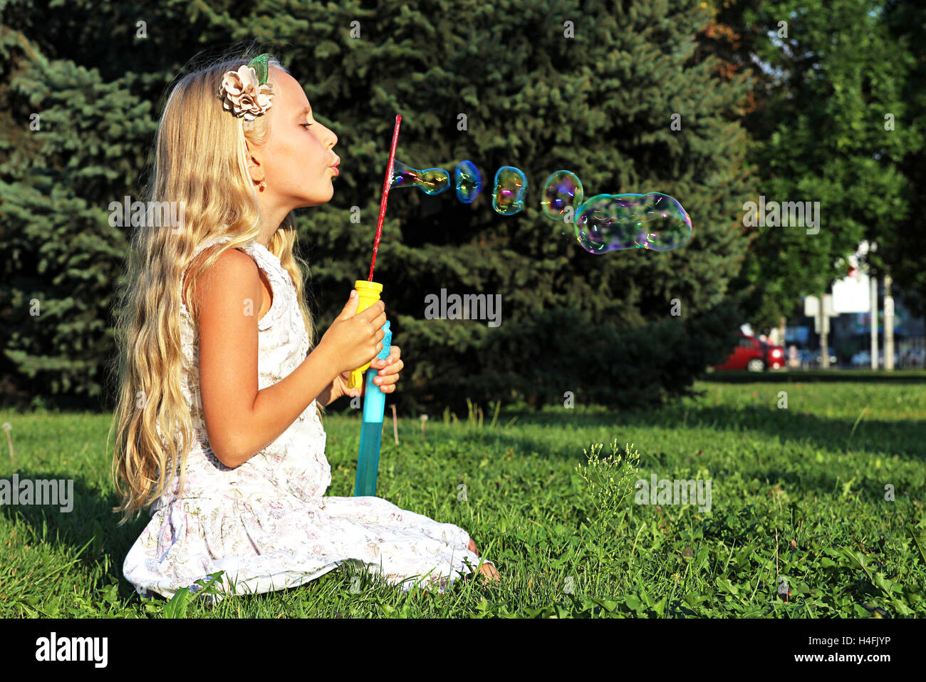Girl In Park Blowing Bubbles On Green Grass Stock Photo Alamy Girl In Park Blowing Bubbles On Green Grass Stock Photo Alamy