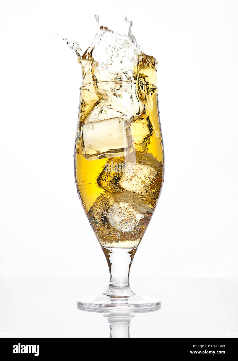 Glass of beer cider with ice cube splash on white background Stock ...
