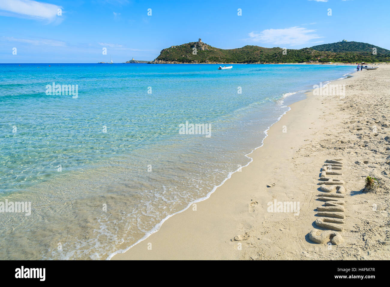 Inscription Villasimius written on a sandy beach - name of beach ...