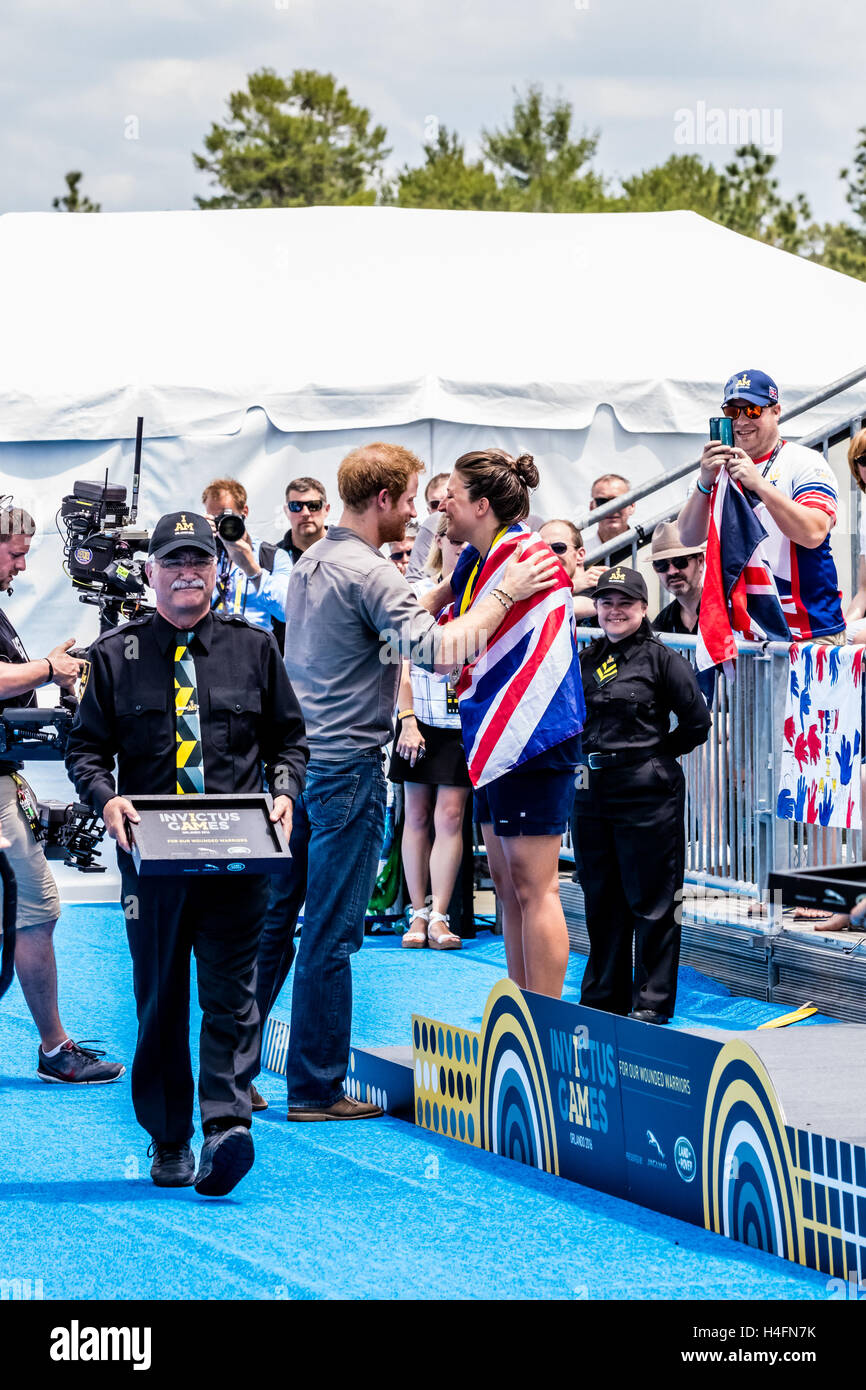 Prince Harry and Fiona Bullen of the United Kingdom share a laugh after ...