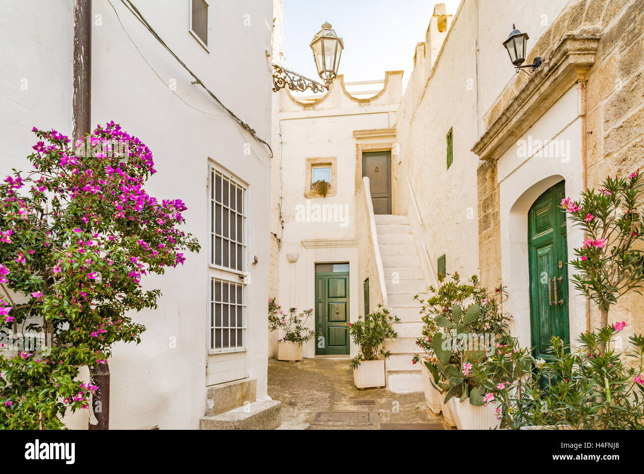 Narrow street of Ostuni, The White City Stock Photo - Alamy