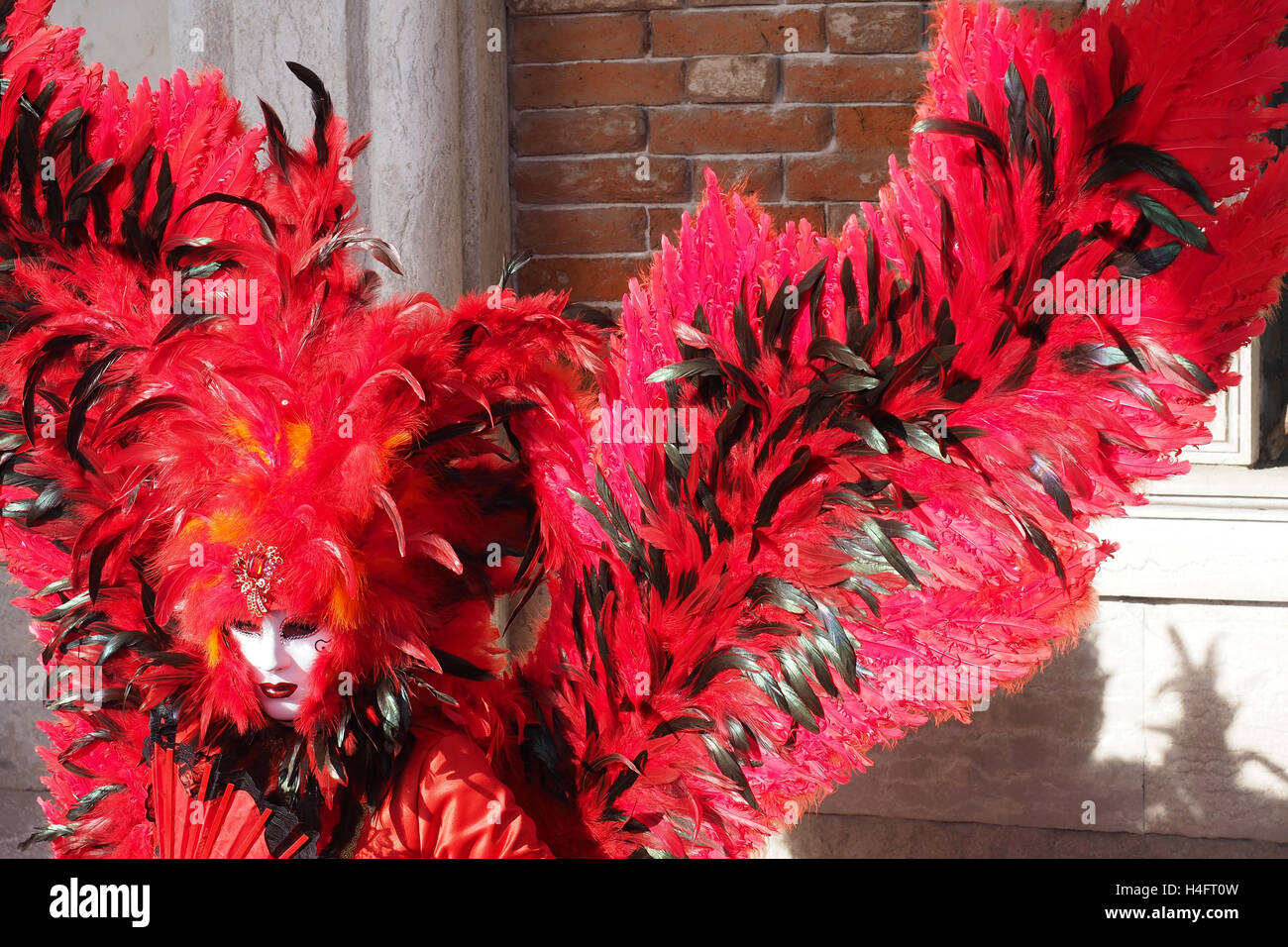 Red wing mask, Venice, Italy Stock Photo - Alamy