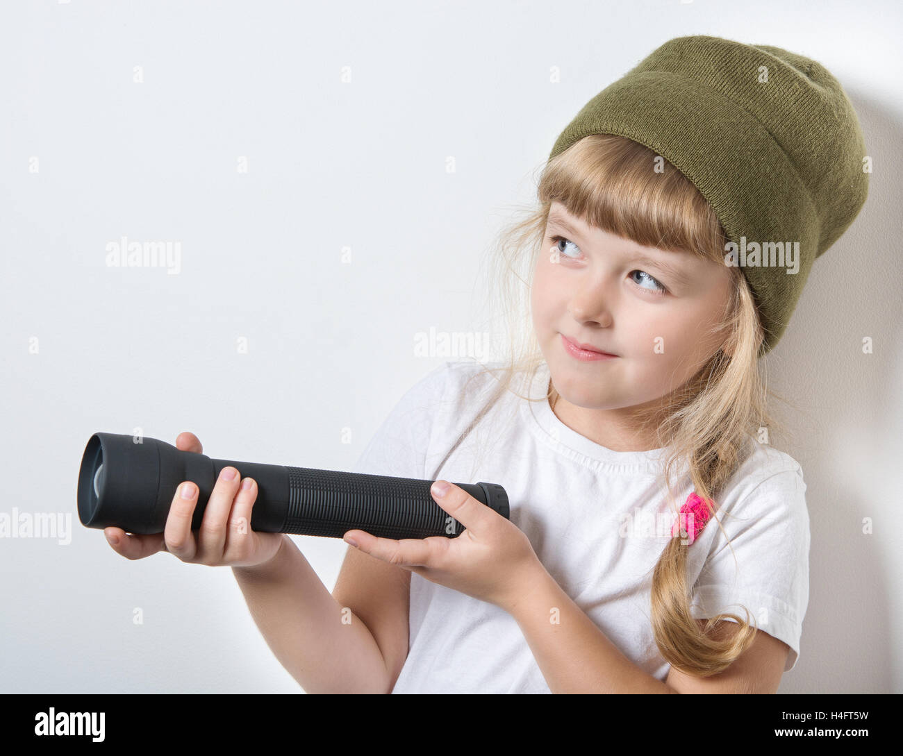 funny little girl with a flashlight Stock Photo - Alamy