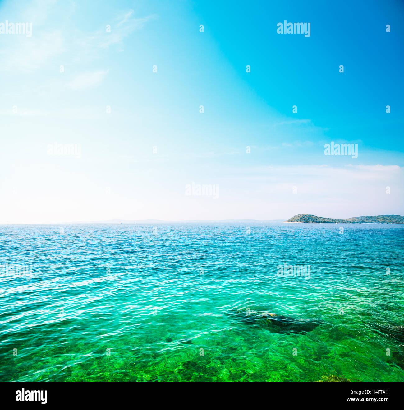 Beautiful Turquoise Sea with Blue Sky and Clouds Stock Photo - Alamy