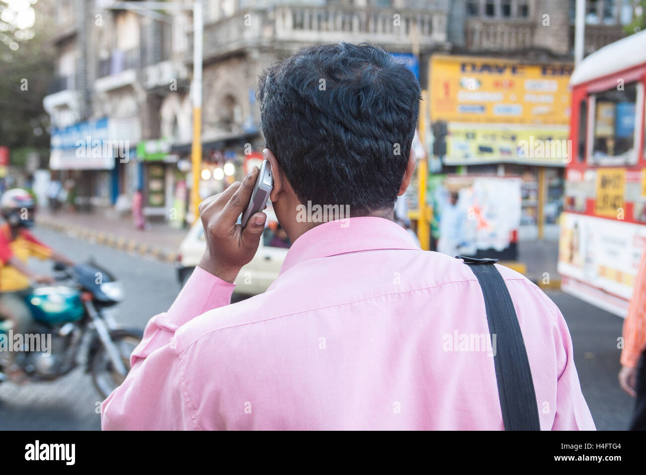 Indian businessman using his mobile phone in centre of colaba hi-res ...