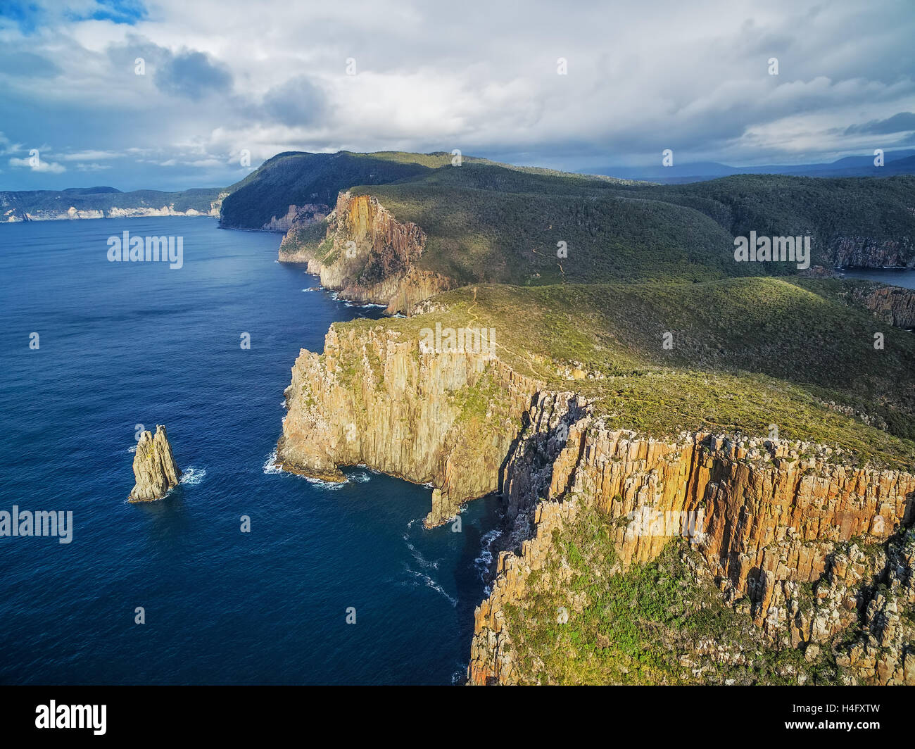 Rugged cliffs of Cape Hauy on bright sunny day aerial view. Tasman ...