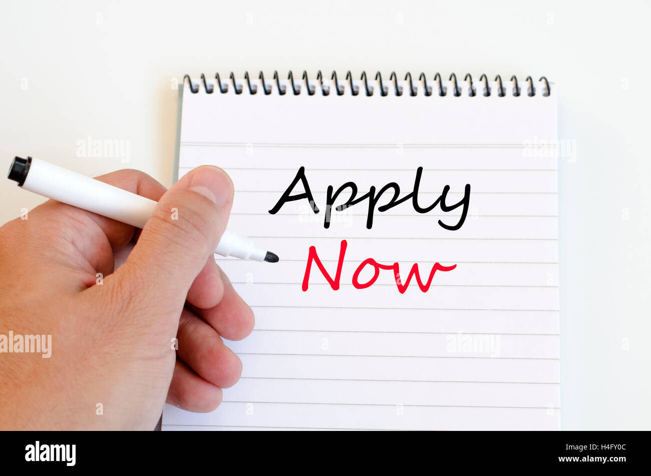 Apply now text concept write on notebook Stock Photo - Alamy