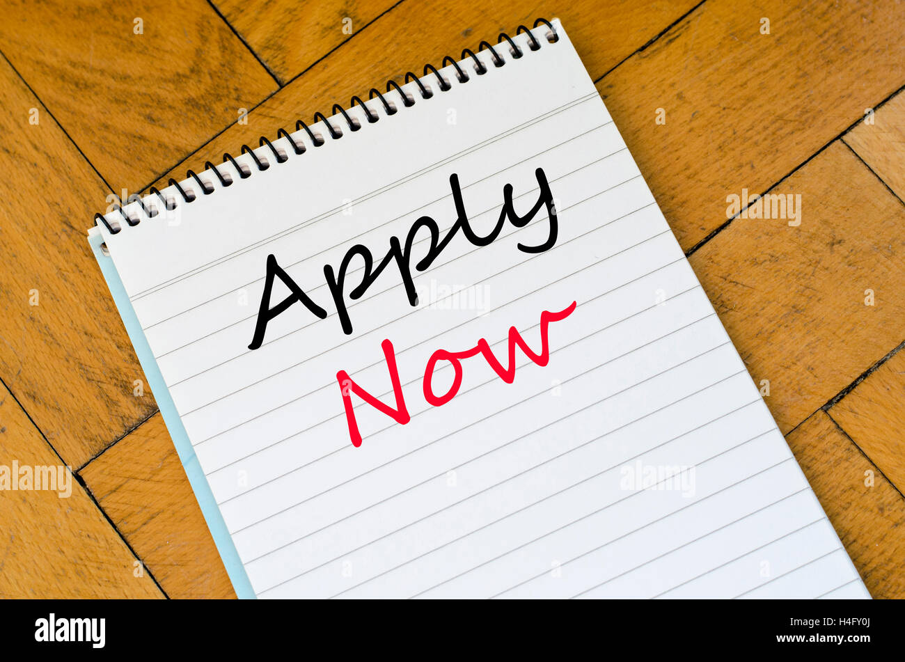 Apply now text concept write on notebook Stock Photo - Alamy