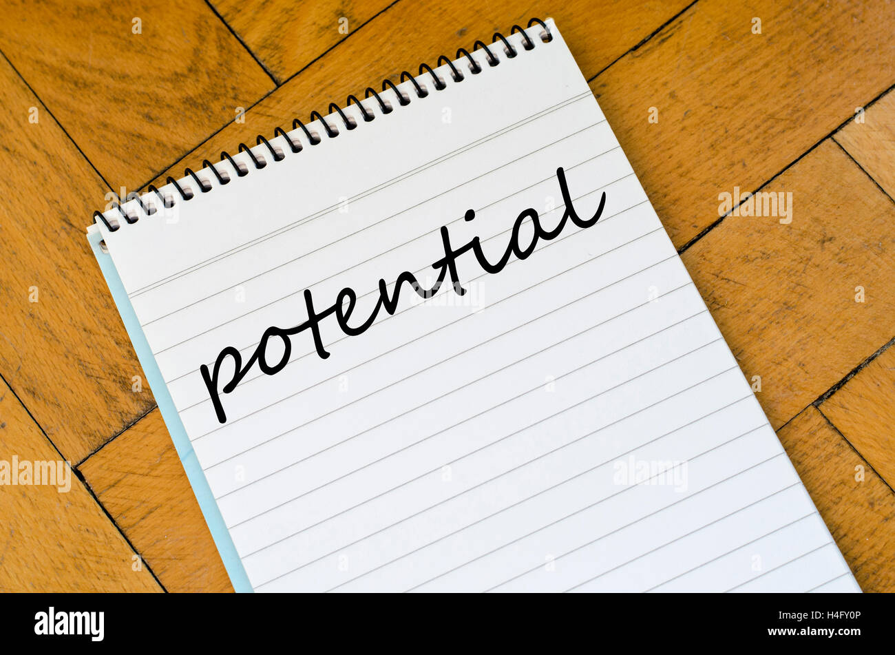 Potential text concept write on notebook Stock Photo - Alamy