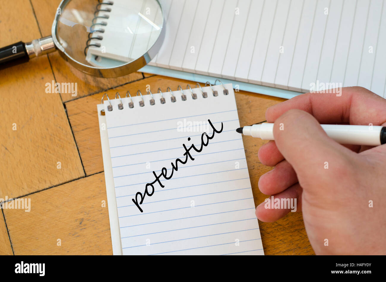 Potential text concept write on notebook Stock Photo - Alamy